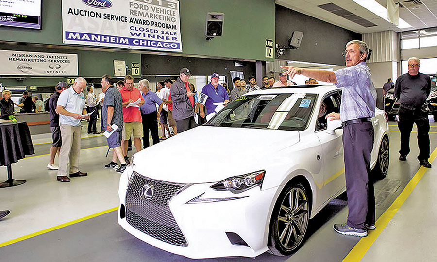 Physical used-car auctions have an online role | Automotive News