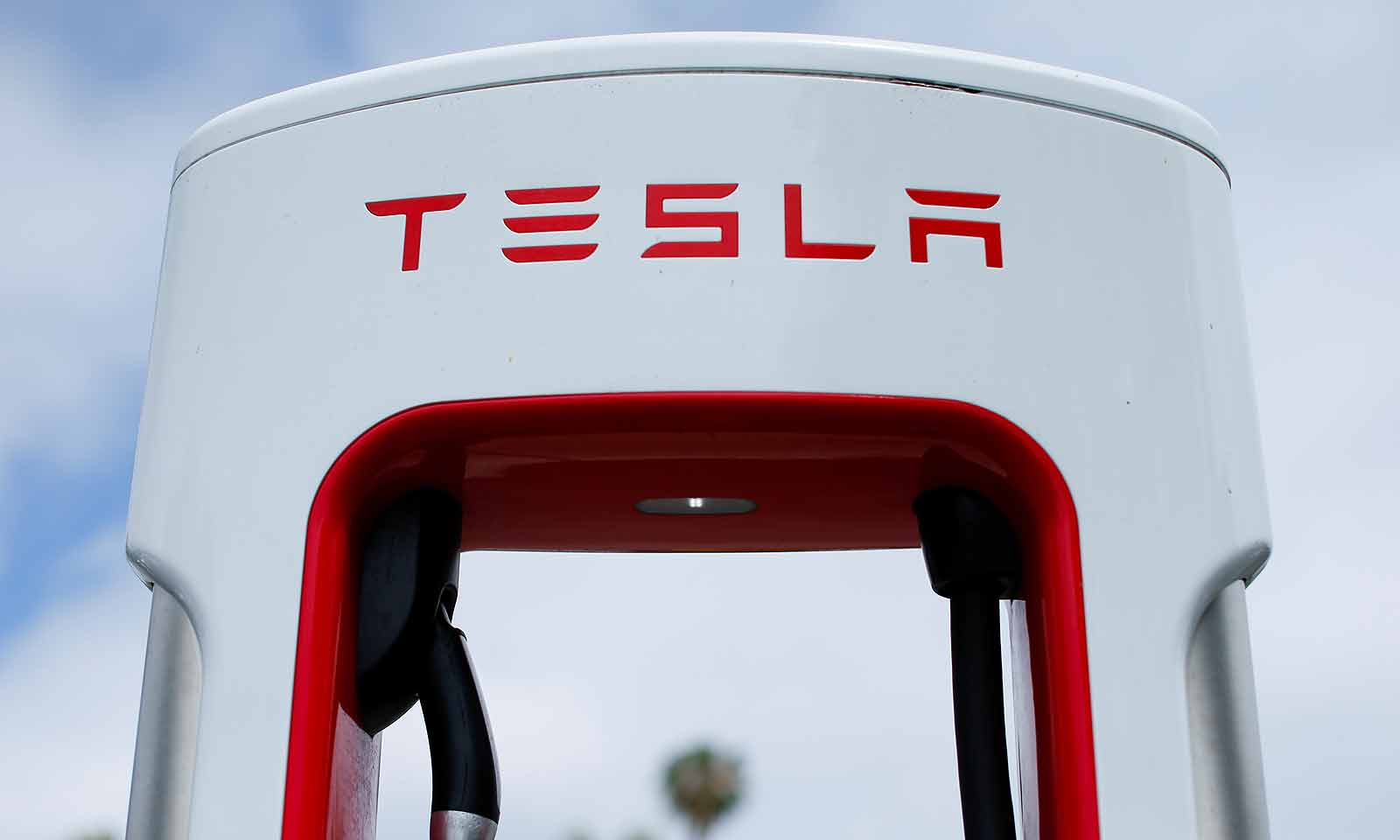 Tesla trims work force as challenges grow