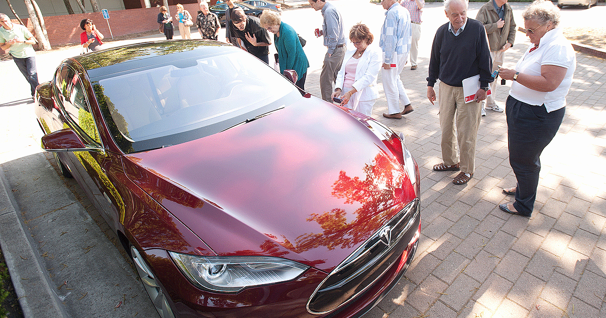 Goliath GM takes a close look at the auto industry's David, Tesla ...